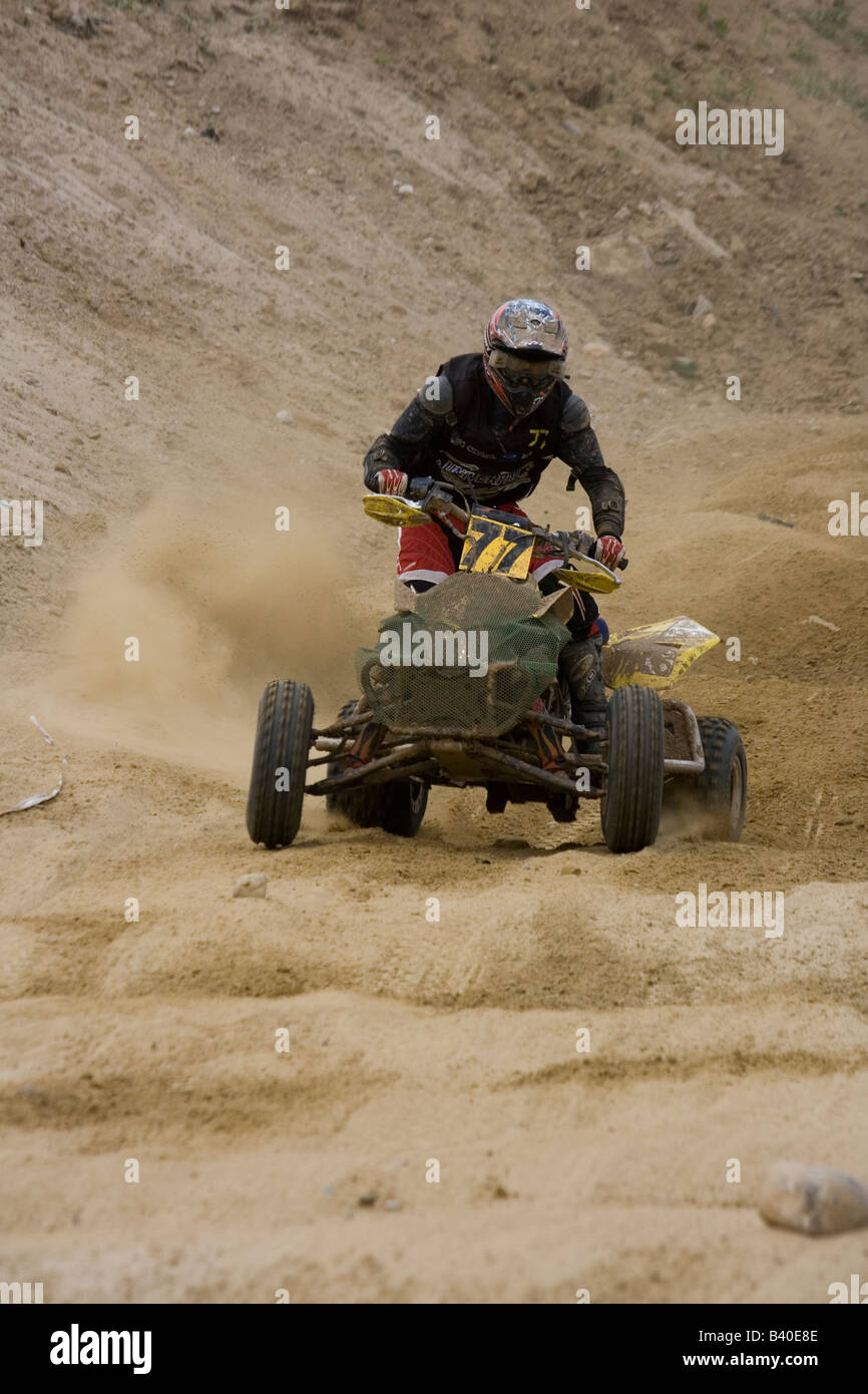 Quad rider during off road race Stock Photo - Alamy