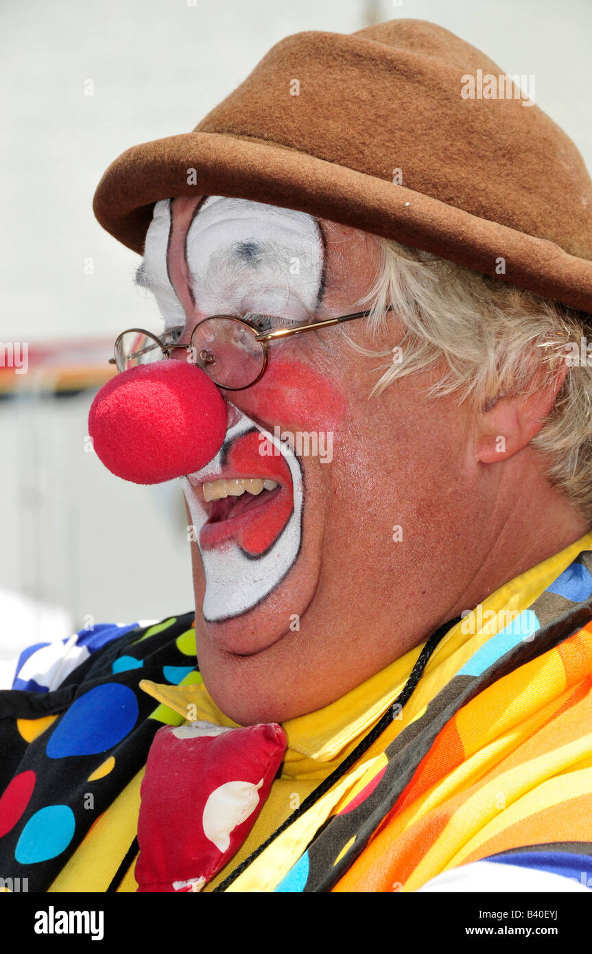 Smiling happy colorful clown Stock Photo - Alamy