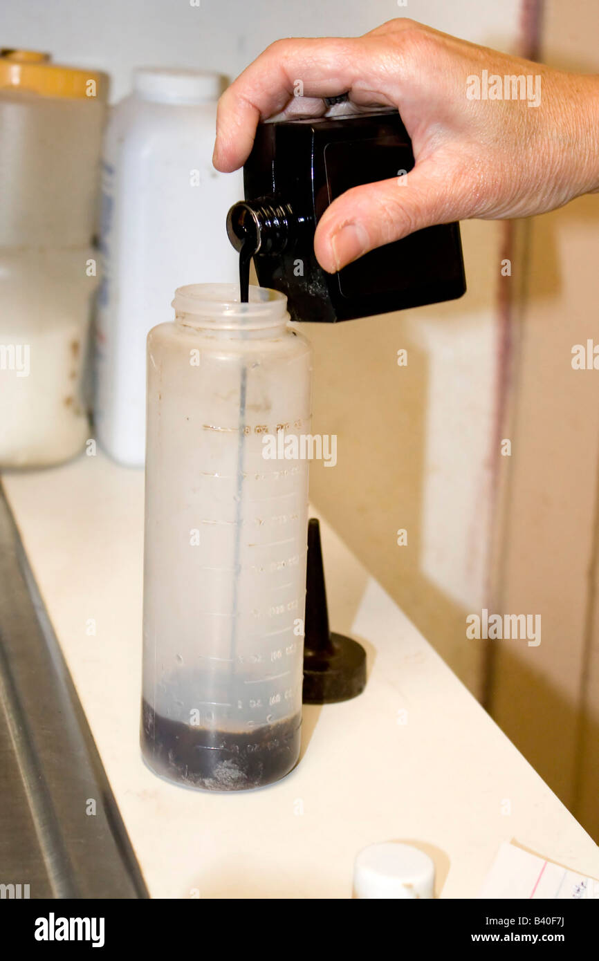 A hairdresser mixing up a hair color formula Stock Photo - Alamy