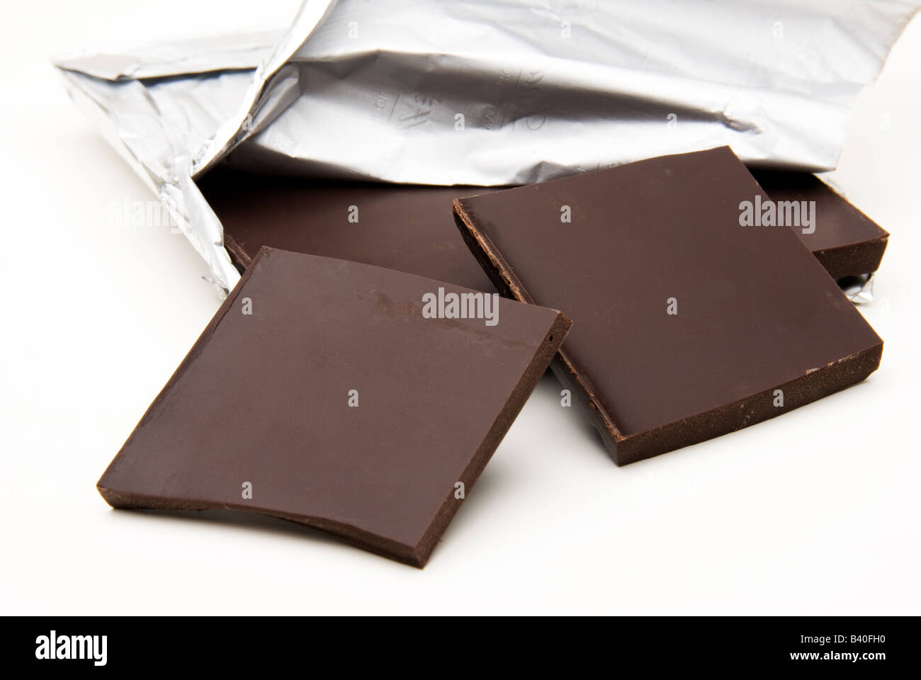Chocolate pieces in wrapping Stock Photo - Alamy