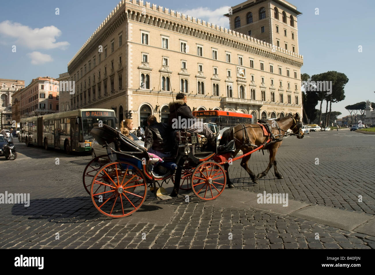 tourists taking a ride in Horse carriage in the pebble street of Rome ...