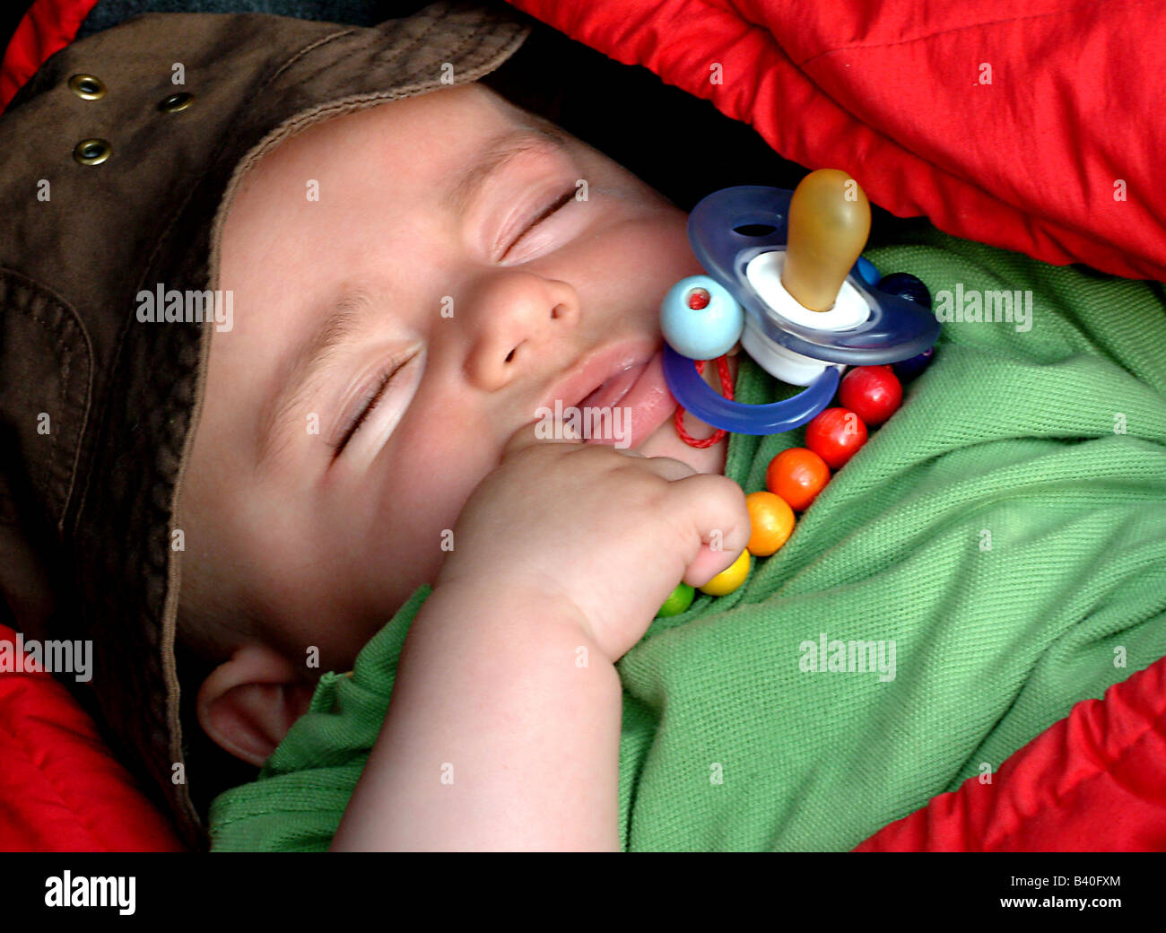 cute baby asleep in stroller with pacifier Stock Photo - Alamy