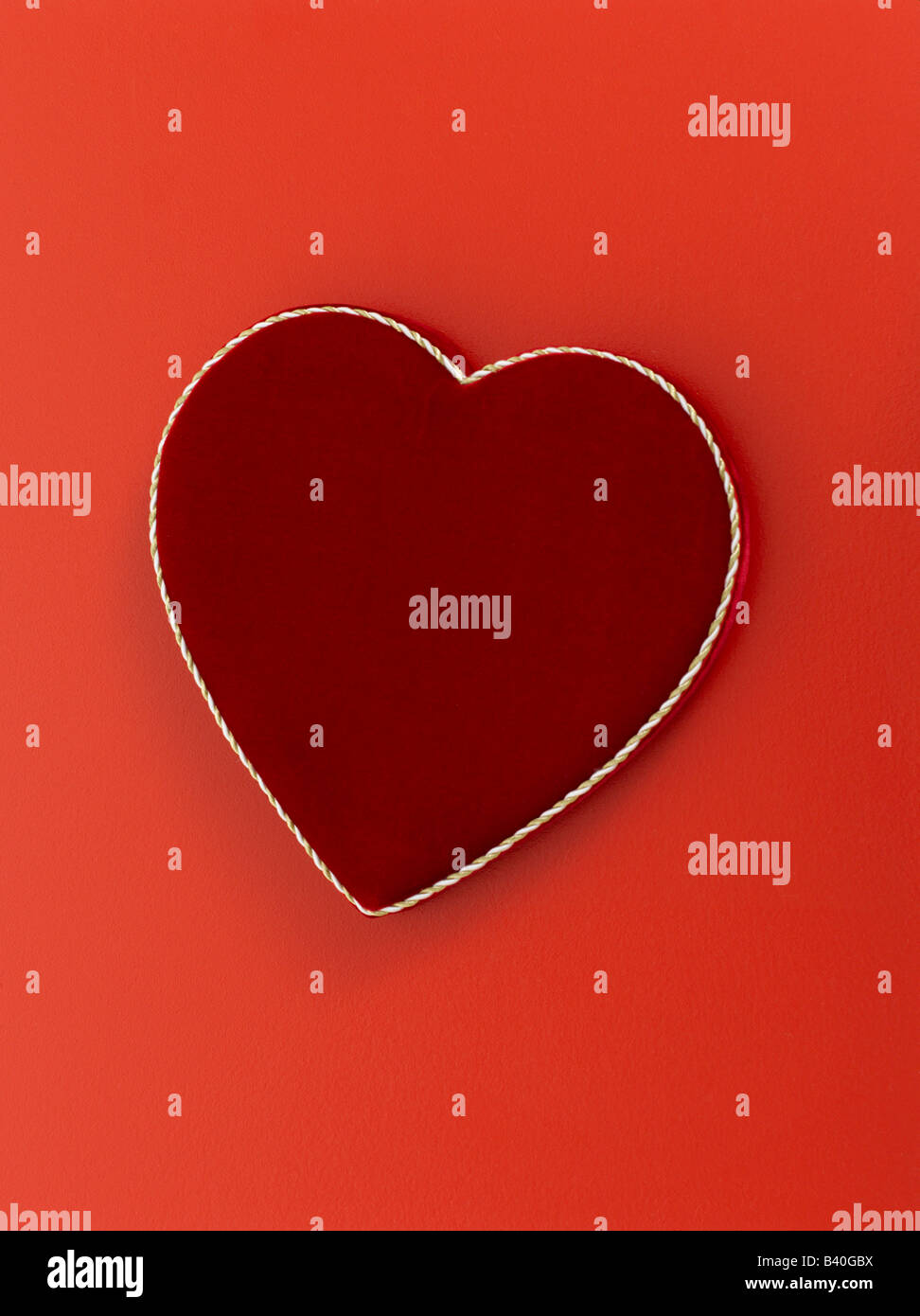 Heart shaped valentines day chocolate box on red background Stock Photo ...