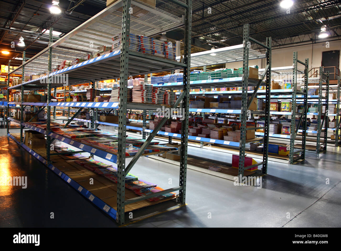 Rows of metal racks at a book warehouse Stock Photo - Alamy