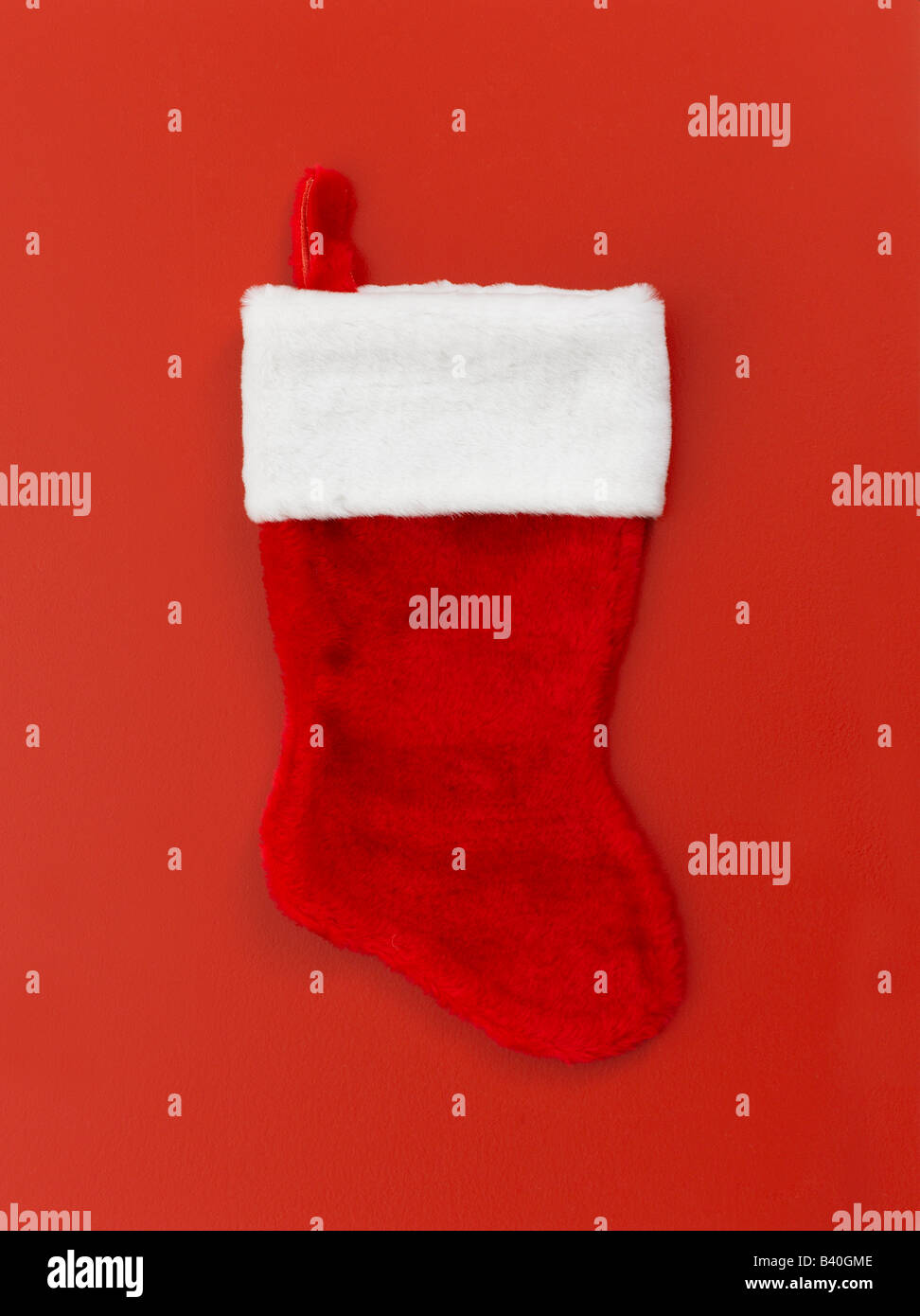 Christmas stocking on red background Stock Photo - Alamy