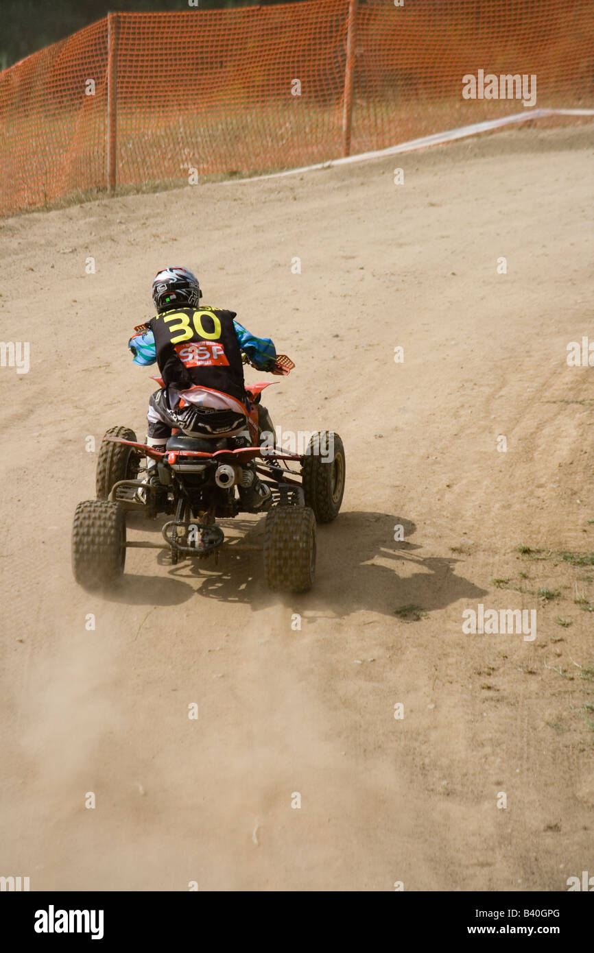 Quad rider during off road race Stock Photo - Alamy
