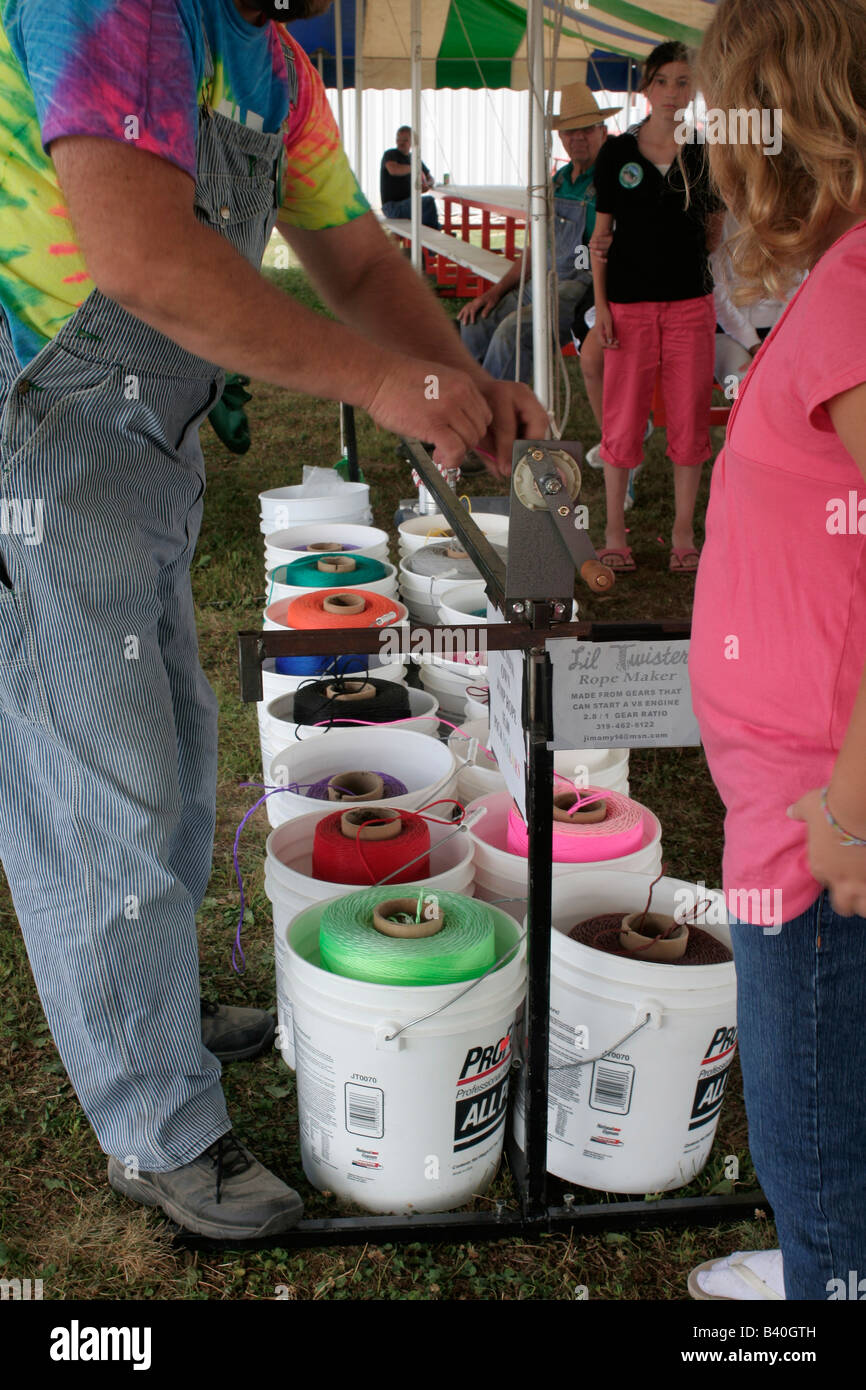 Rope maker making colorful childrens jump ropes Stock Photo - Alamy