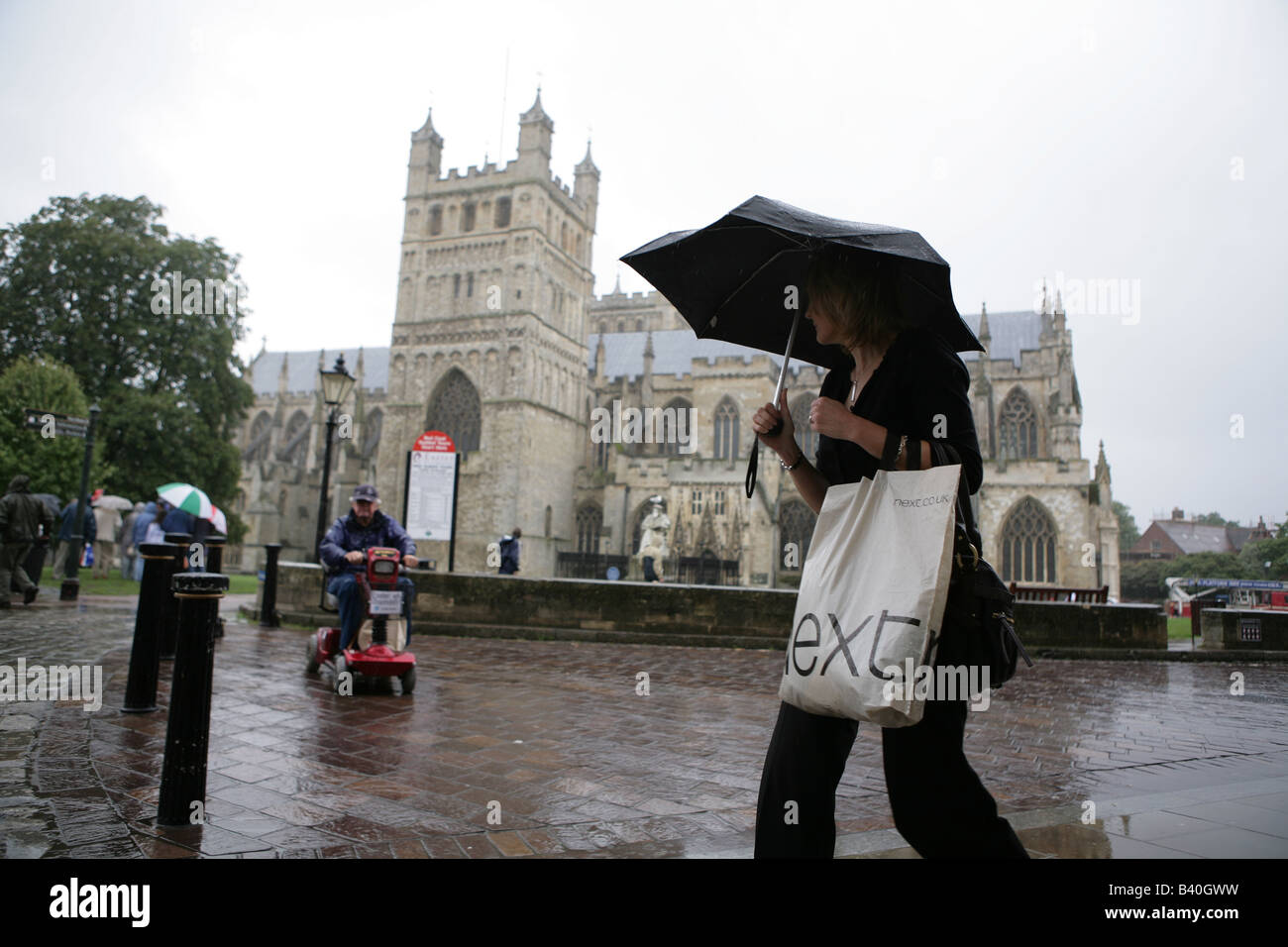 People in Exeter in the rain Stock Photo - Alamy