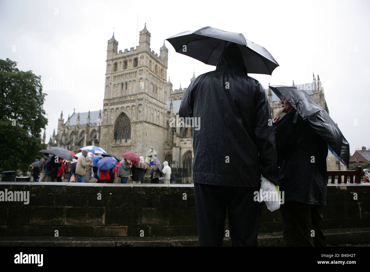 People in Exeter in the rain Stock Photo - Alamy