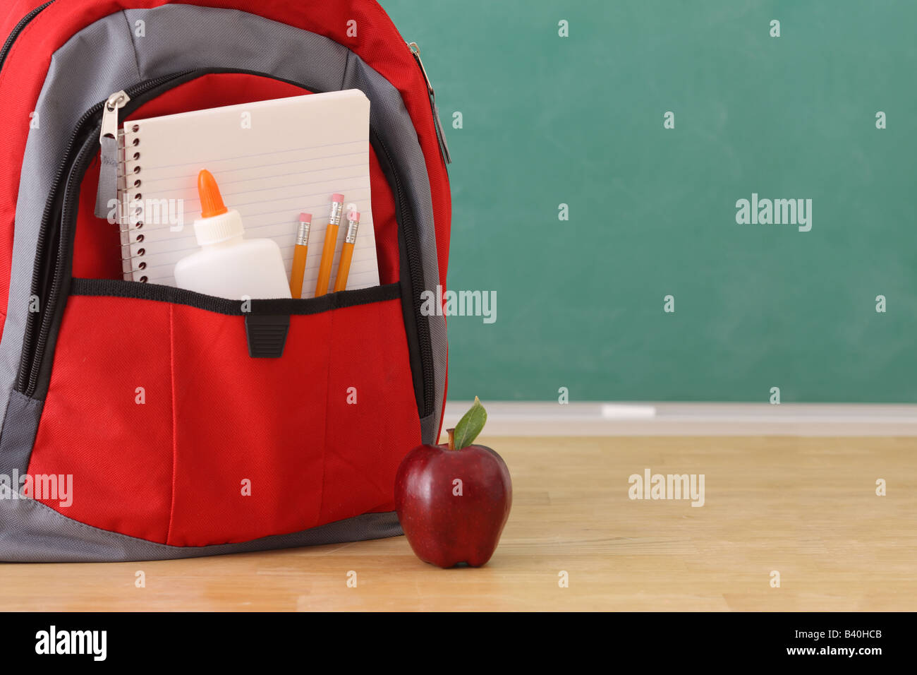 School education still life backpack full of school supplies and red ...