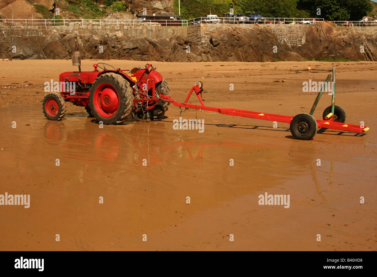 Tractor launch on a beach Stock Photo - Alamy