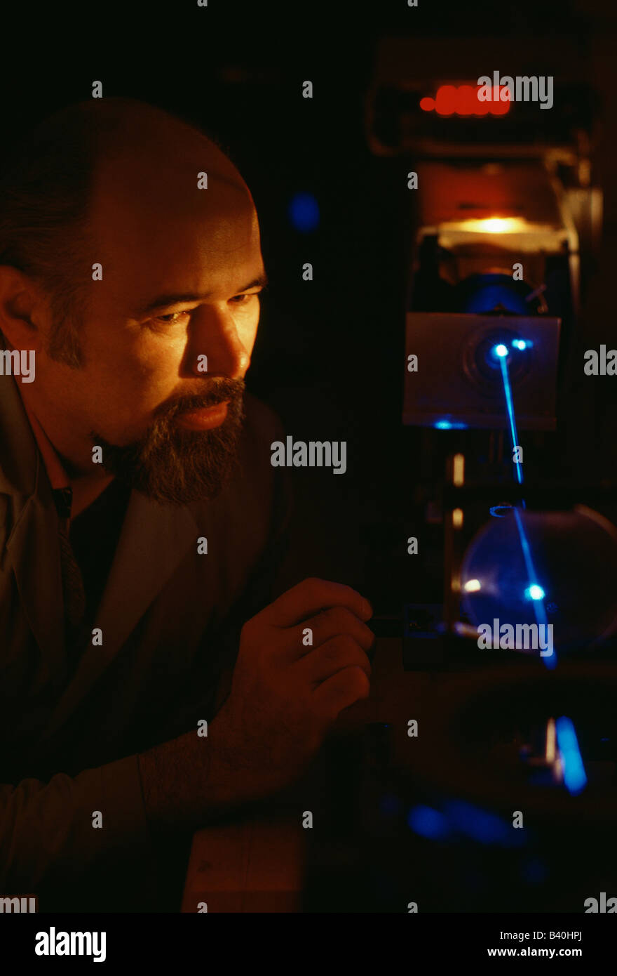 Scientist using a laser beam in a laboratory Stock Photo - Alamy