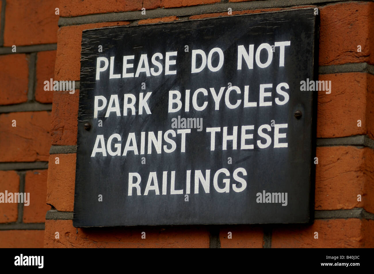 Sign - Please do not park bicycles against these railings Stock Photo ...