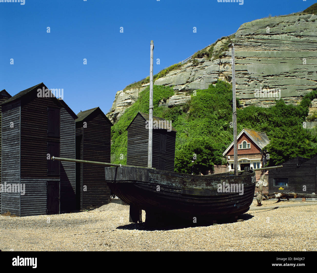 Hastings fishing boat and net huts, Rock-a-Nore, East Sussex, England ...