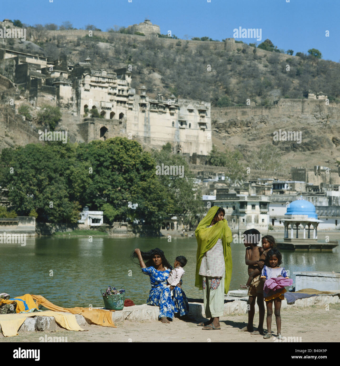 Rajasthani local people by the lake in front of the Taragarh Fort ...