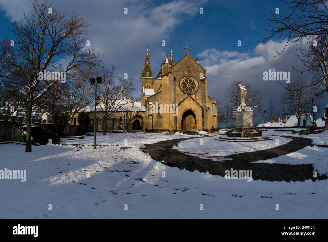 One of Neuchatel's favorite tourist attractions, the Collegiale ...
