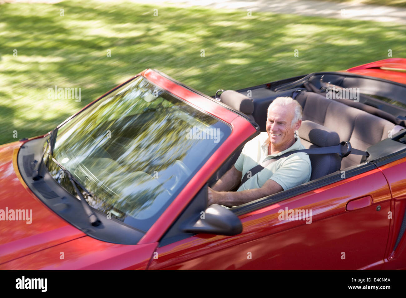 Man in convertible car smiling Stock Photo - Alamy