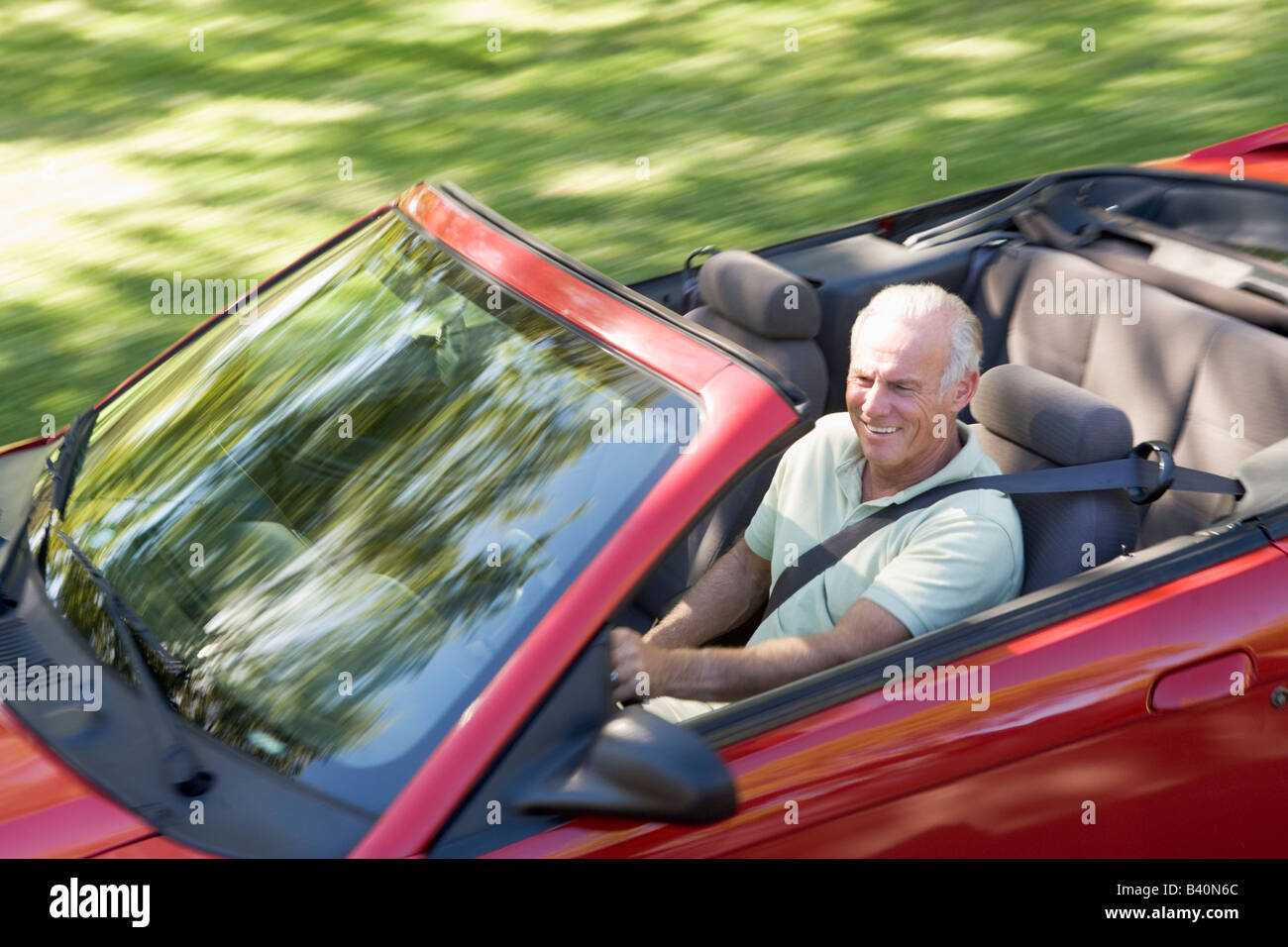 Man in convertible car smiling Stock Photo - Alamy