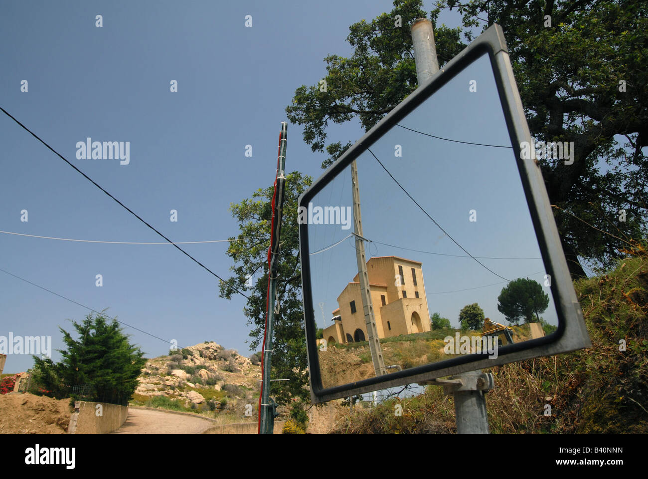 A view into a road mirror to give motorist advance warning of oncoming ...