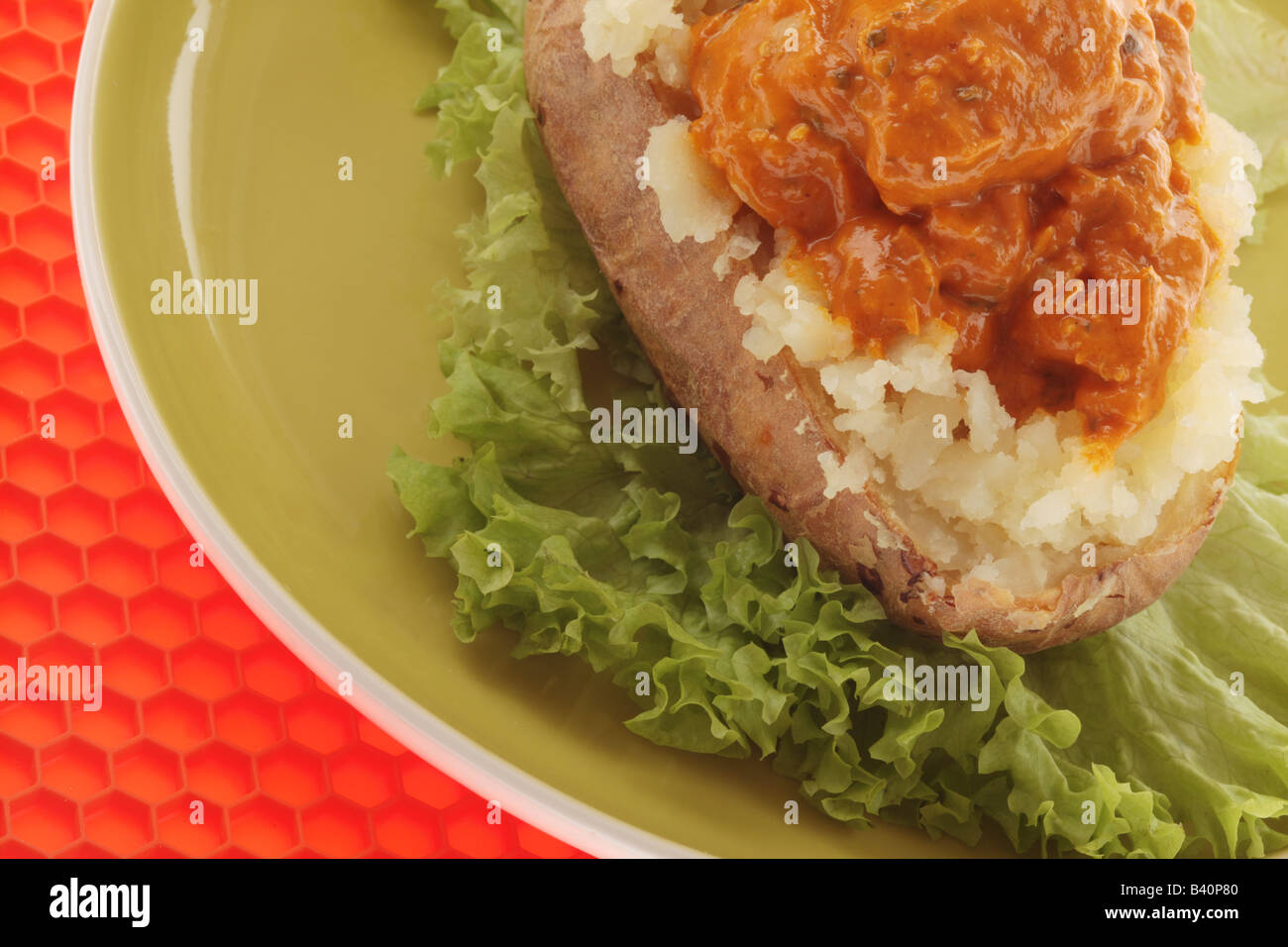 Freshly Baked Jacket Potato Filled With Indian Style Spicy Chicken ...