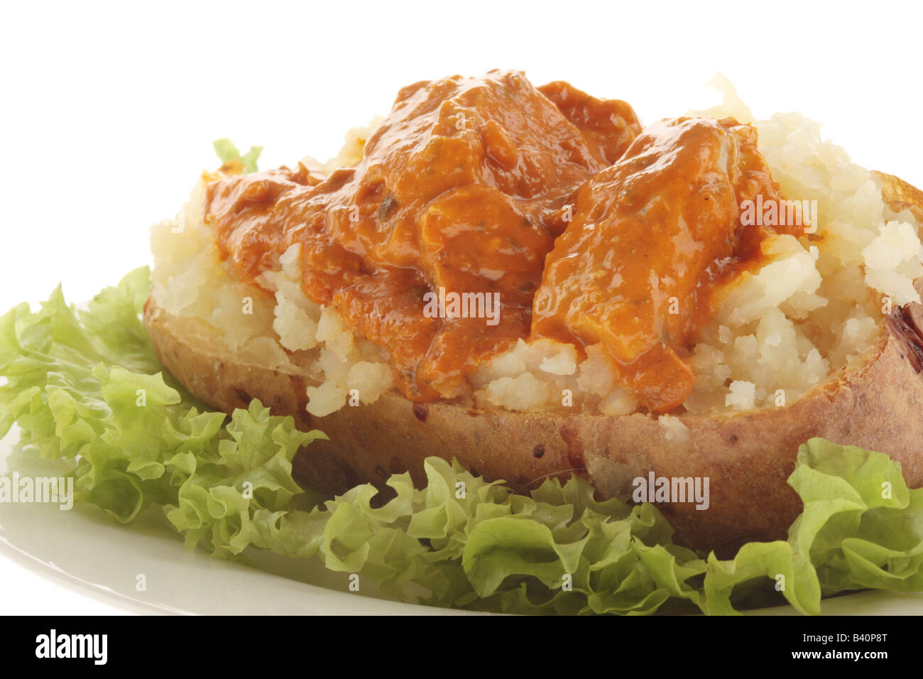 Freshly Baked Jacket Potato Filled With Indian Style Spicy Chicken ...