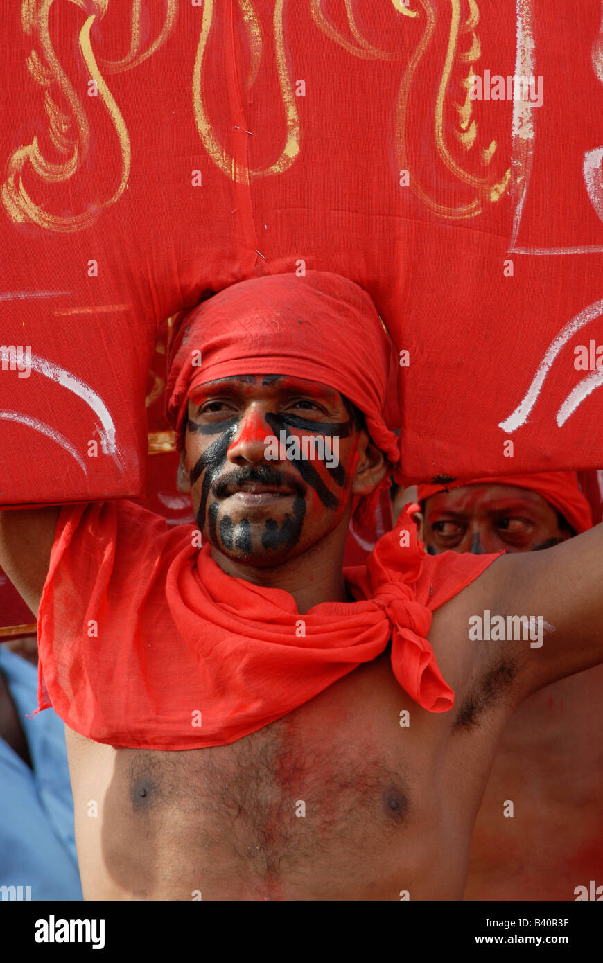 Face paint on a man participating in a hindu religious procession in ...