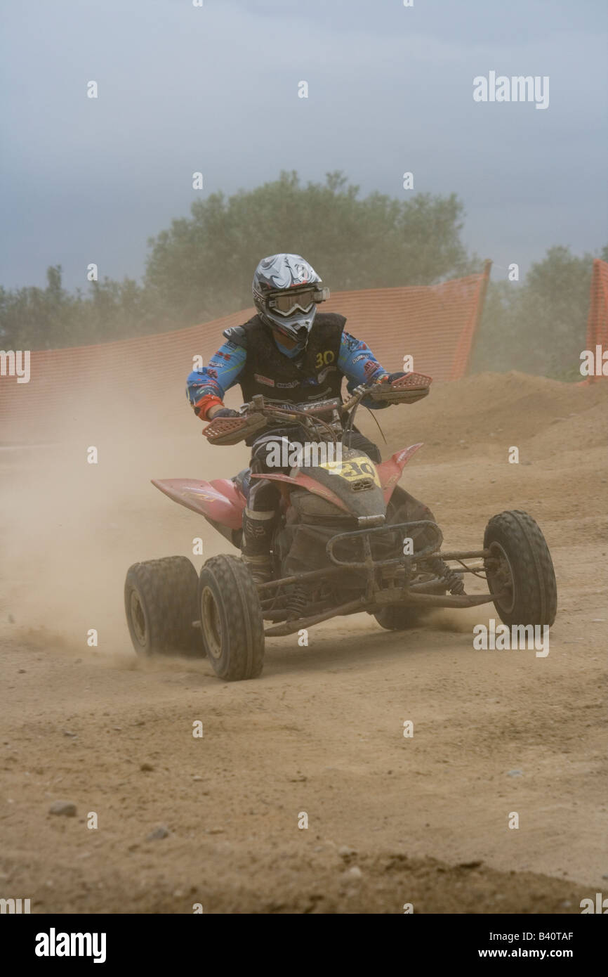 Quad rider during the cross country race Stock Photo - Alamy