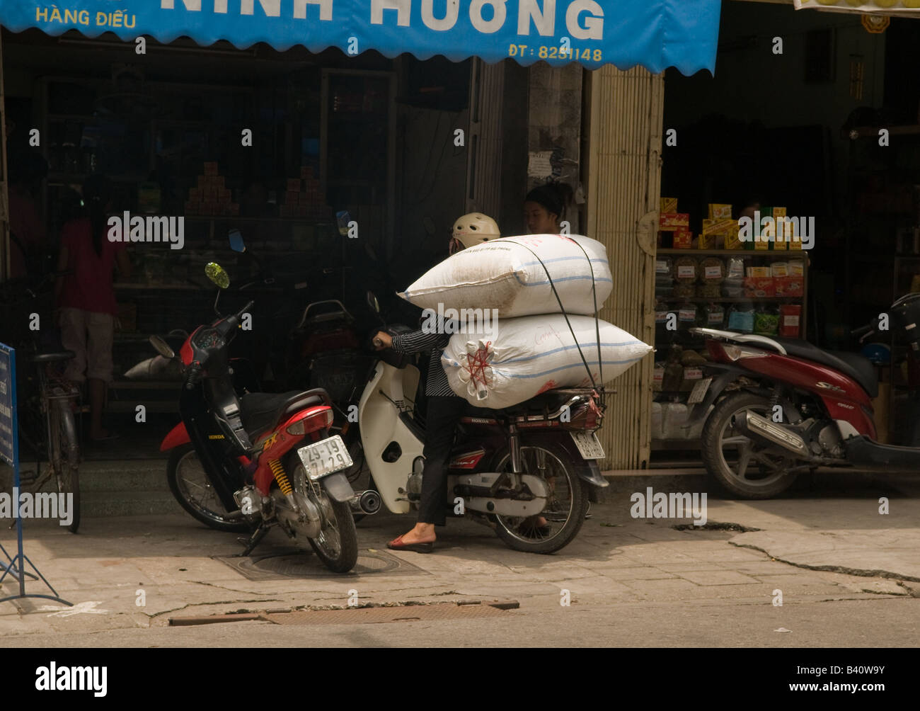Transporting rice to the shop Stock Photo - Alamy