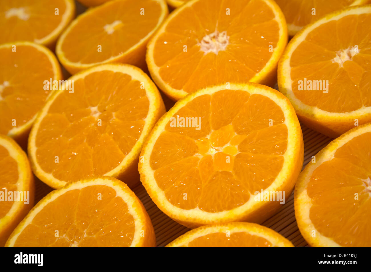 Orange halves side by side Stock Photo - Alamy