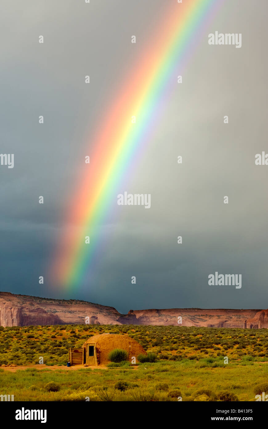 USA, Utah, Monument Valley Navajo Tribal Park. Rainbow over a Navajo ...