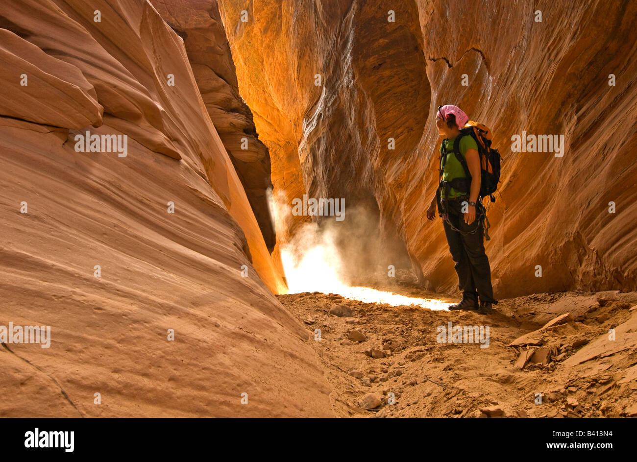 USA, Utah. A female canyoneer inside Chute Canyon on the San Rafael ...