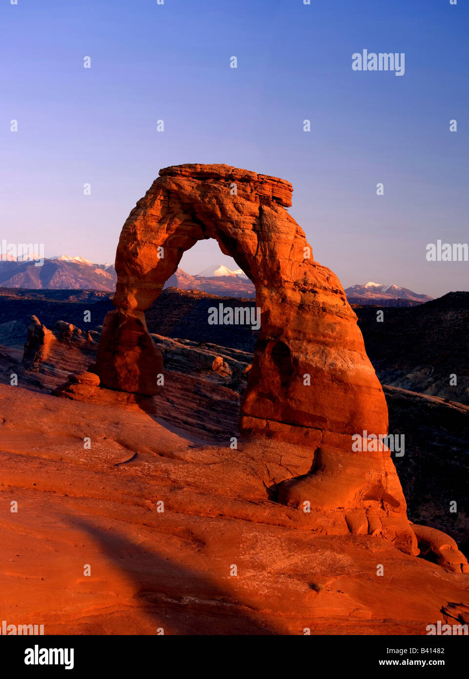 Delicate Arch at Sunset with snow covered La Sal mountains in the ...