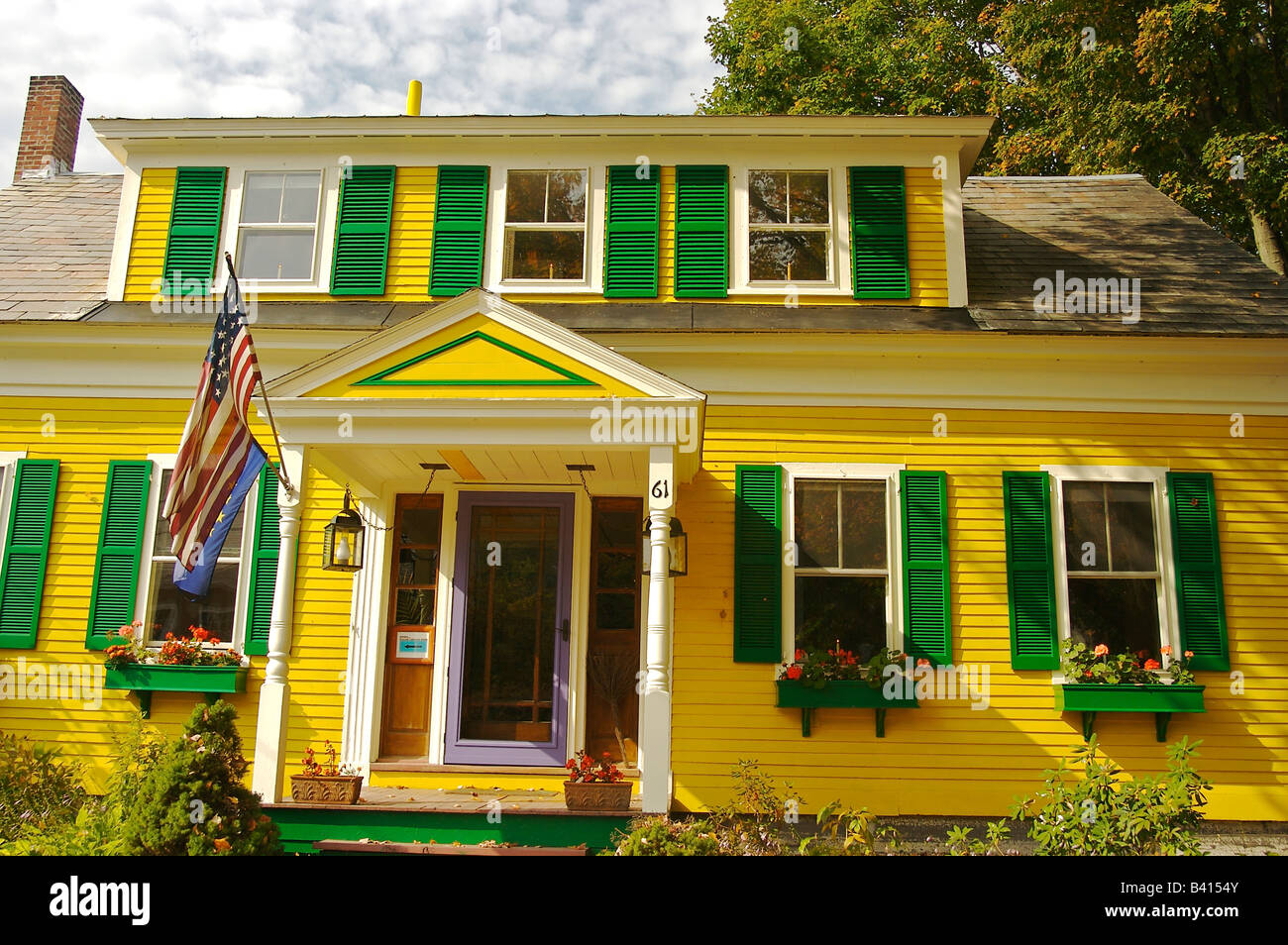 North America, USA, Vermont, Woodstock. The bright yellow facade of the ...