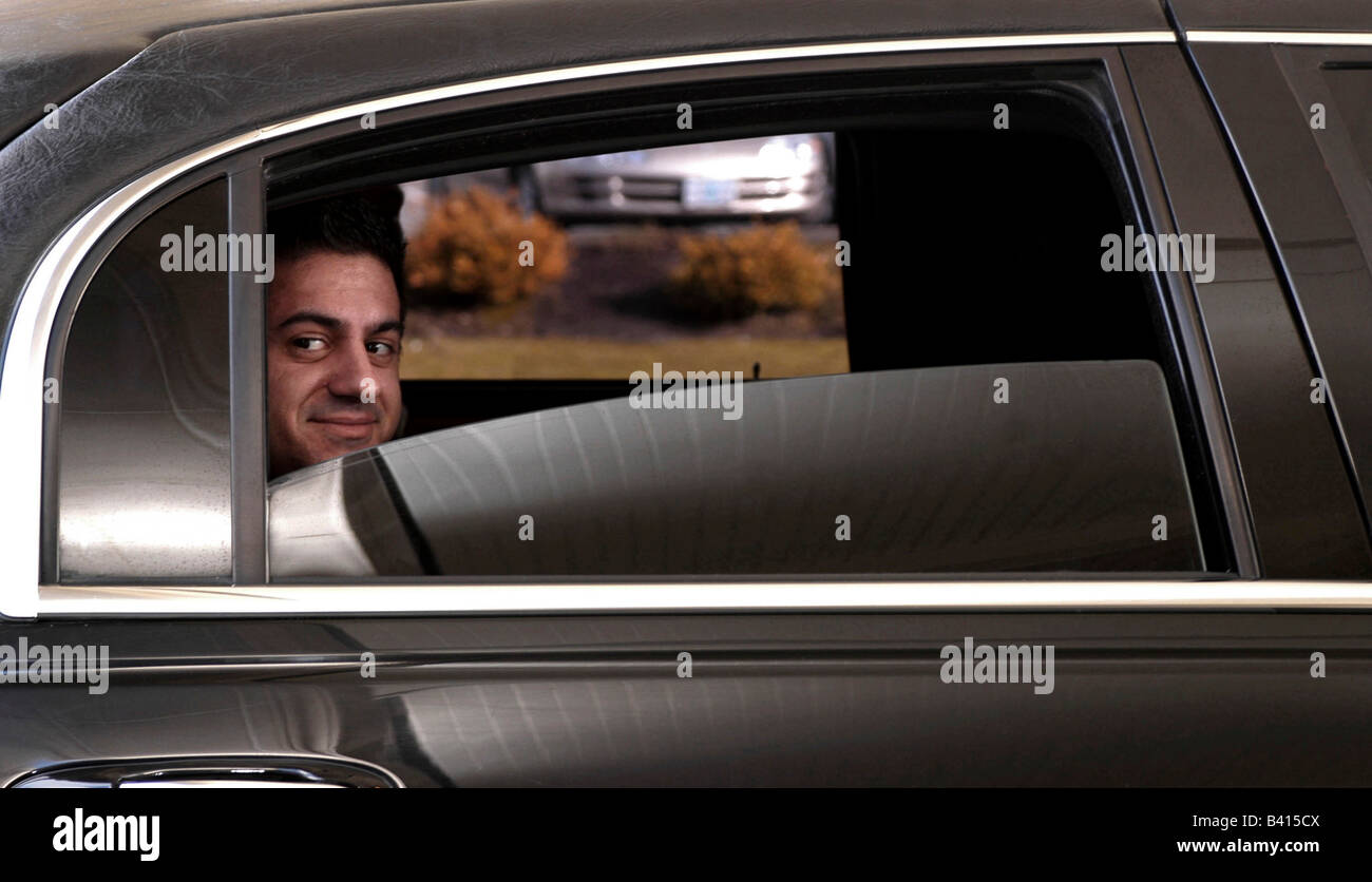 USA, Seattle, Washington, Groomsman smiling in the black limousine ...