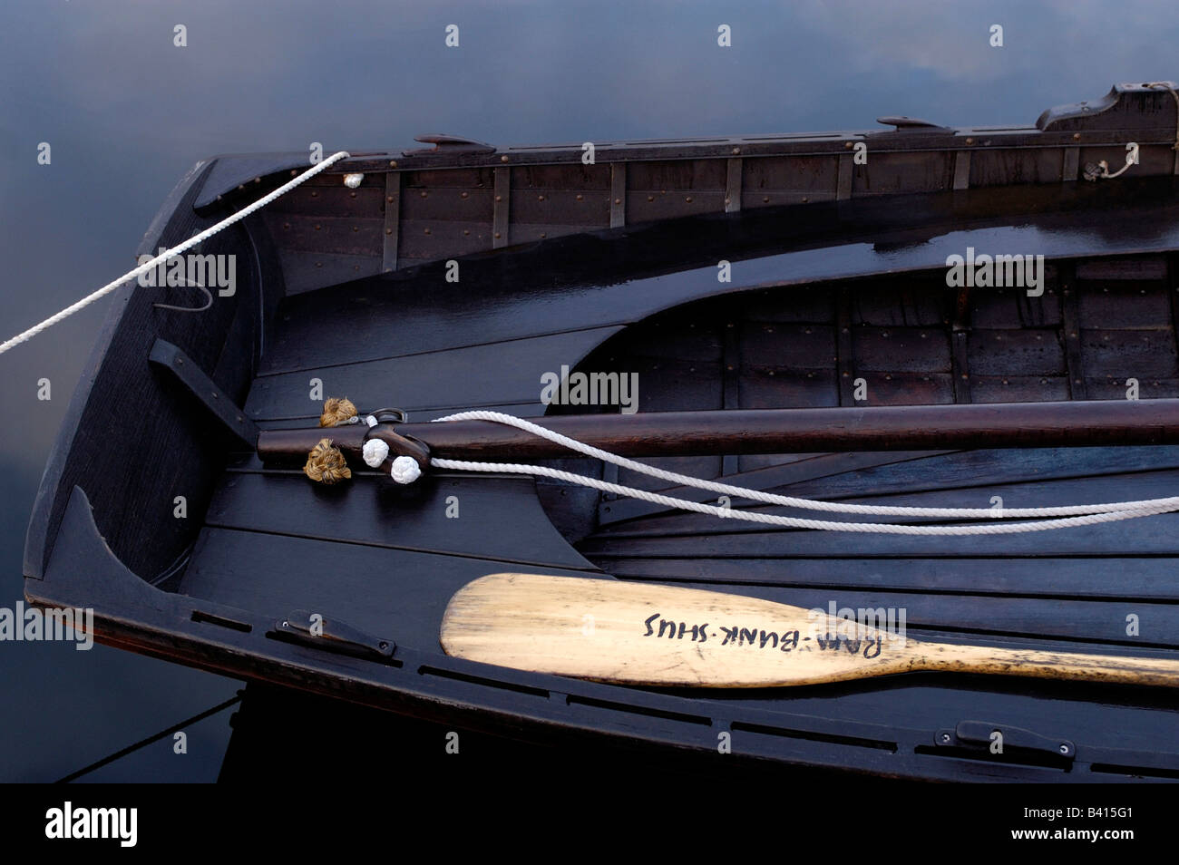 USA, Seattle, WA, Paddle on seat of rained upon wooden boat Stock Photo ...