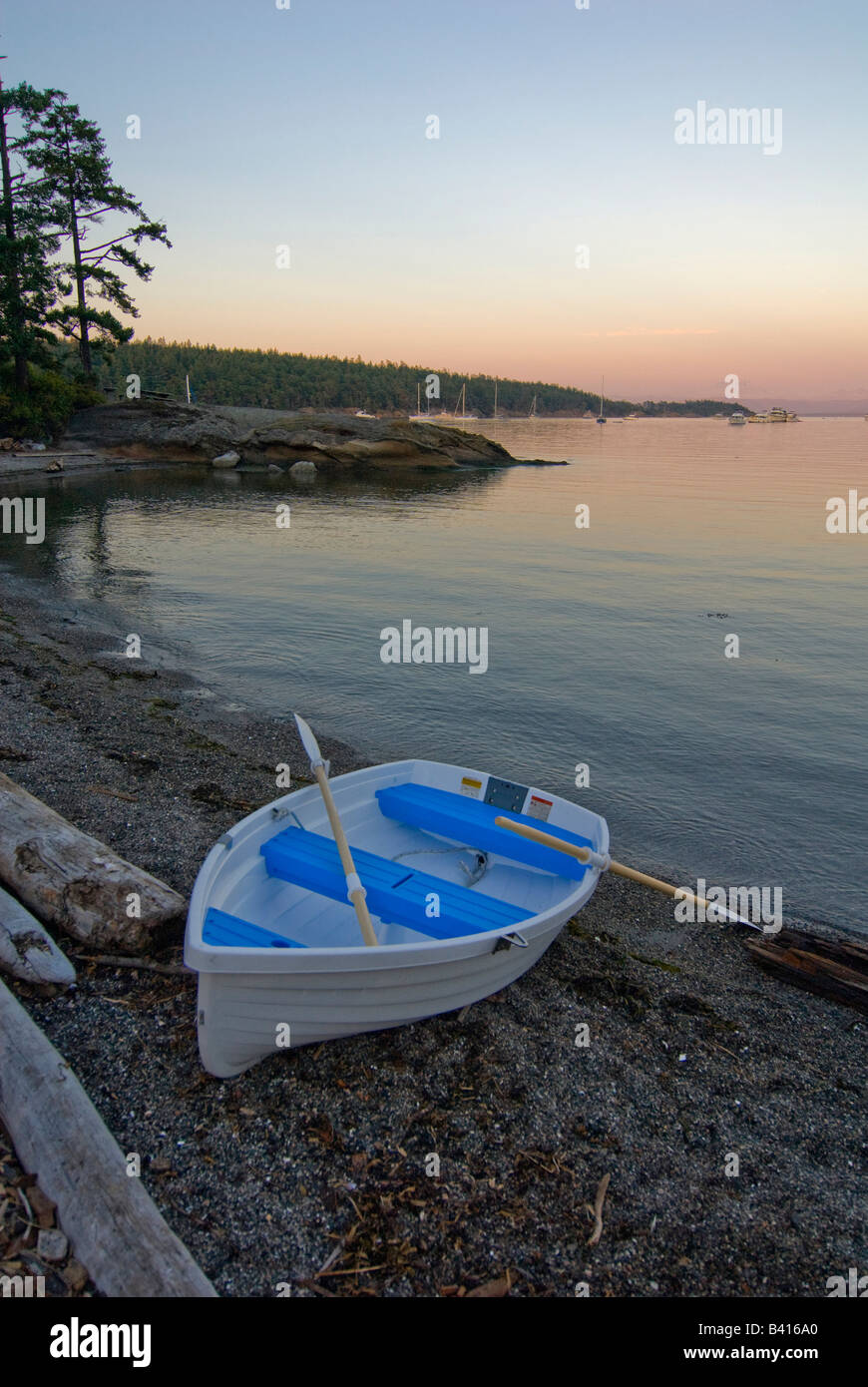 USA, Washington, San Juan Islands. An empty rowboat on the beach at ...