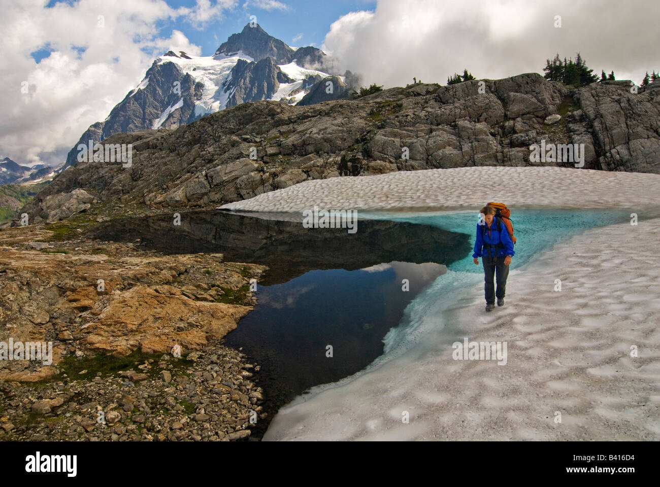 USA, Washington, North Cascades. A female hiker near Mt. Shuksan and ...