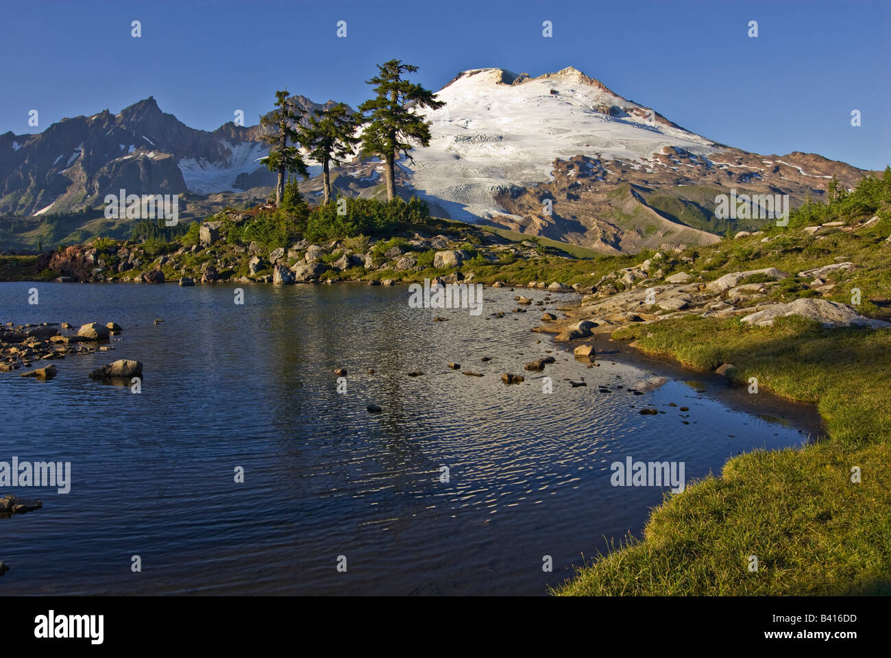USA, Washington, Mt. Baker. Mt. Baker and tarn on Park Butte Stock ...