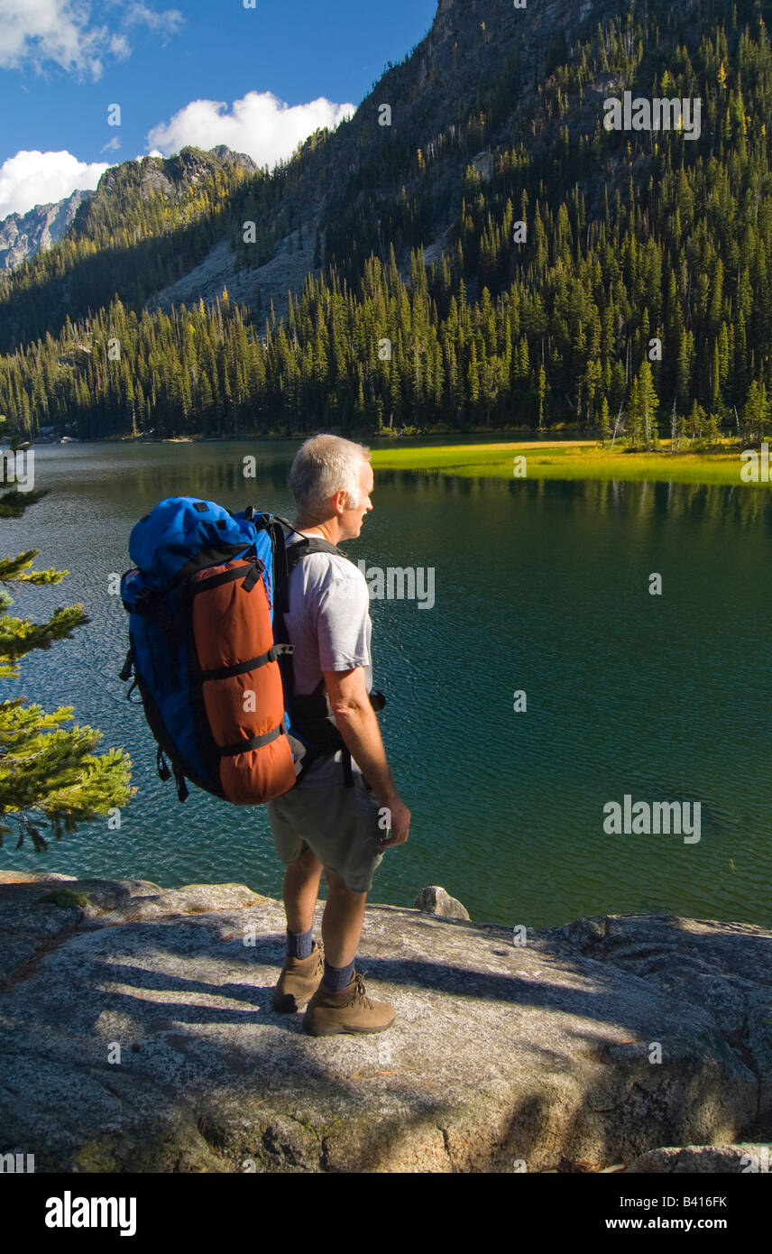 USA, Washington, Cascade Mountains. A senior citizen hiker at Lake ...