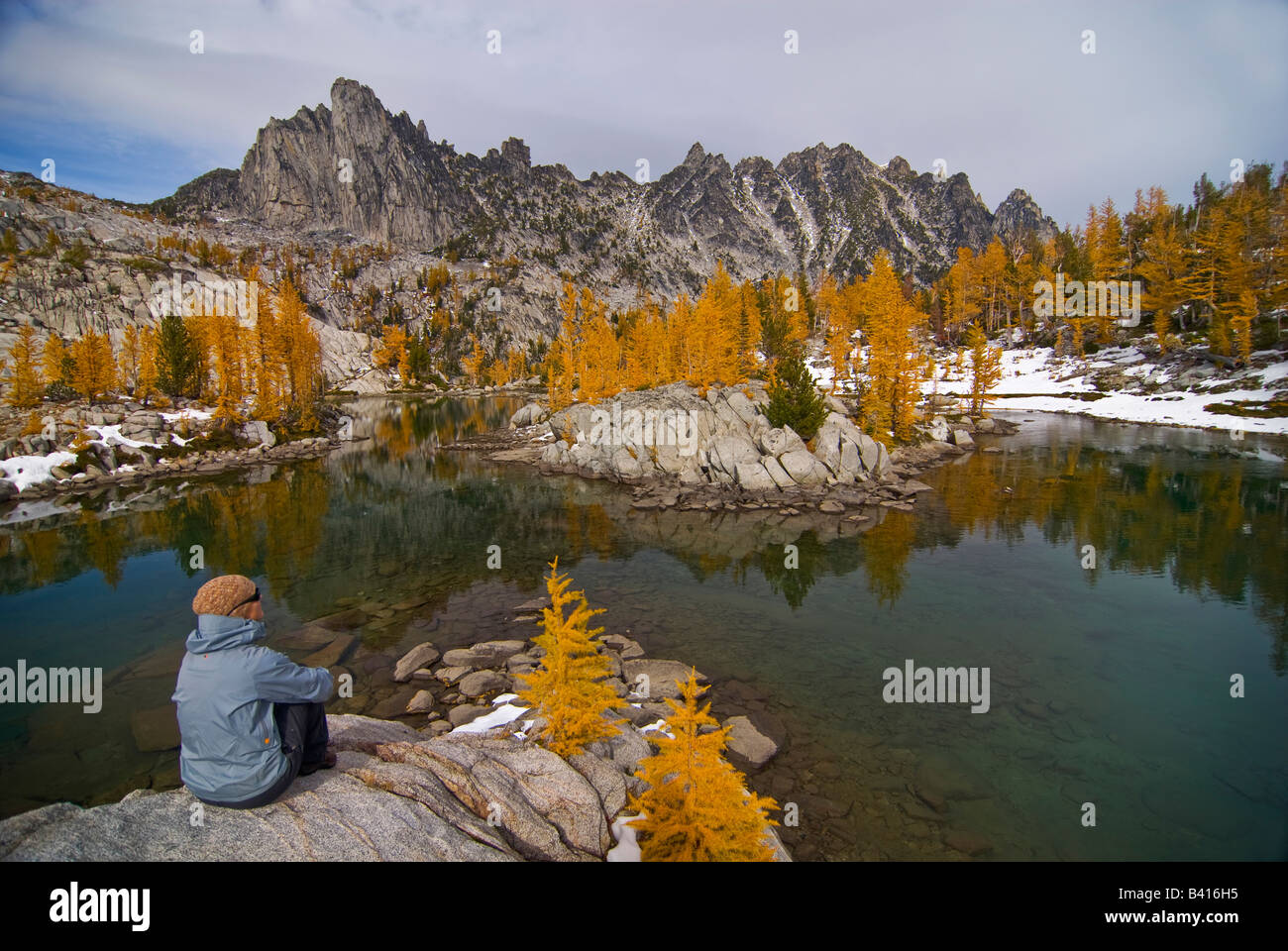 USA, Washington, Cascade Mountains. A female hiker takes a rest in the ...