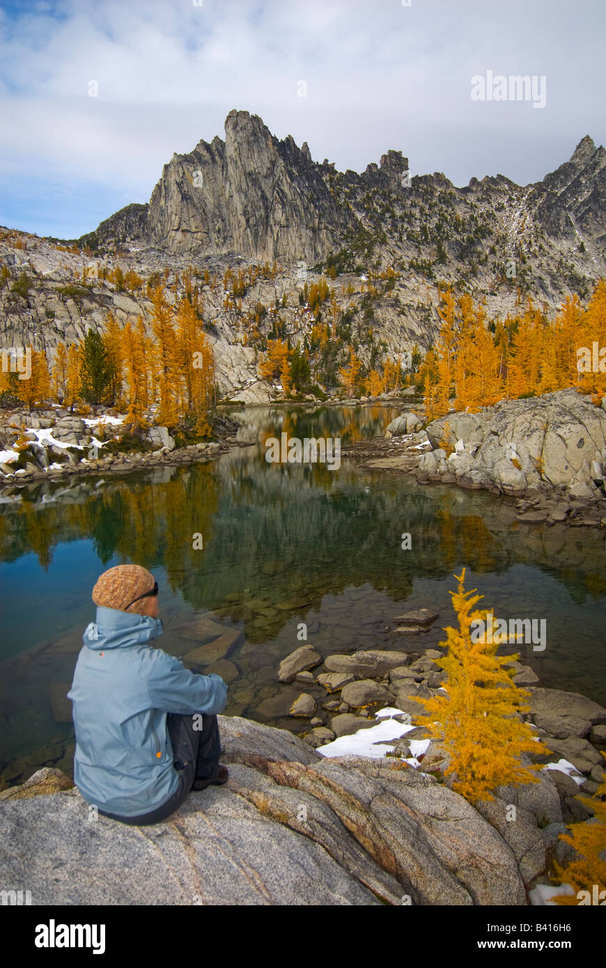 USA, Washington, Cascade Mountains. A female hiker takes a rest in the ...