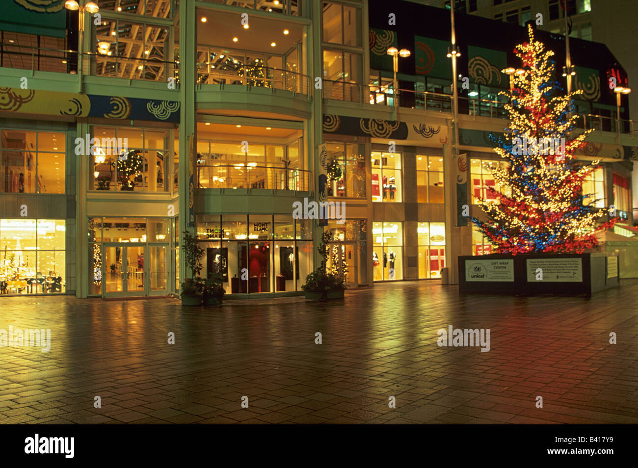 WA, Seattle, Westlake Center with lighted tree during holiday season ...