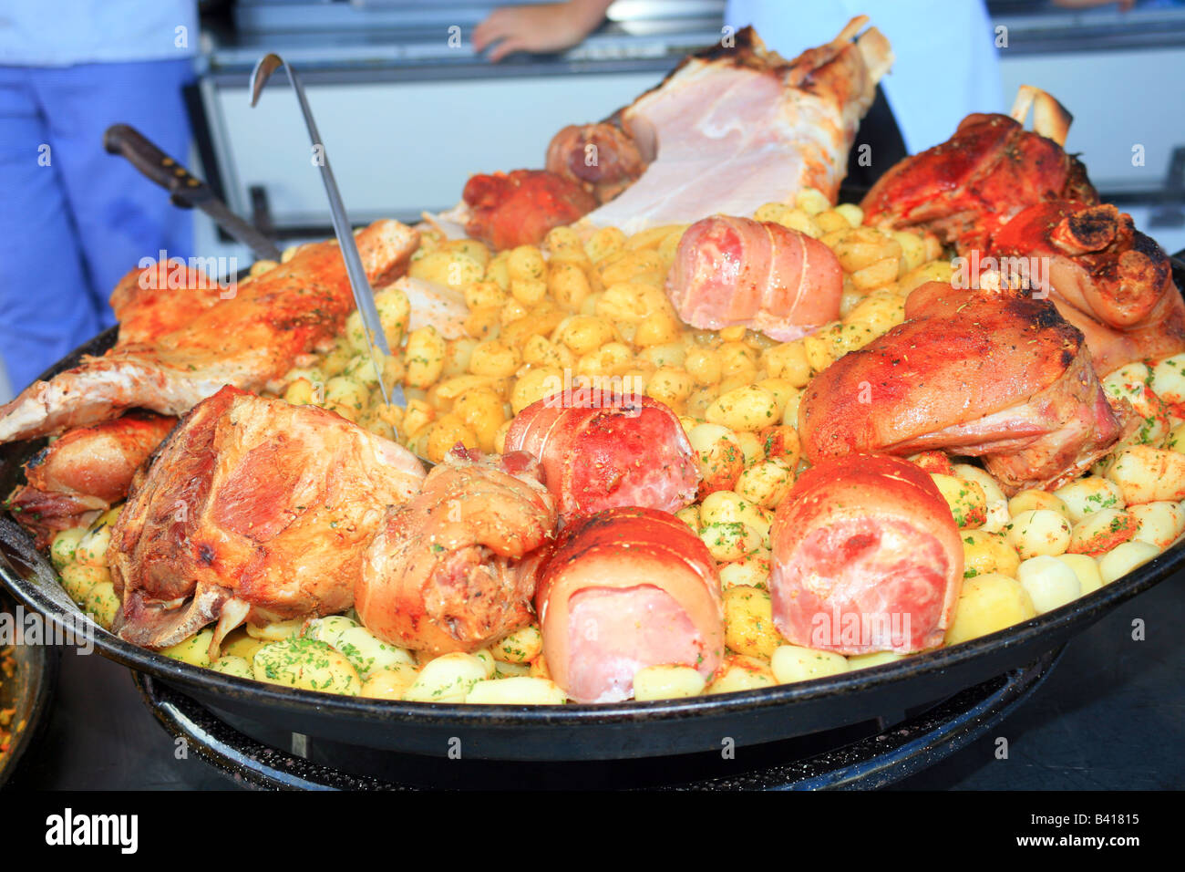 Display of cooked food for sale on market stall, St Cast, Brittany ...