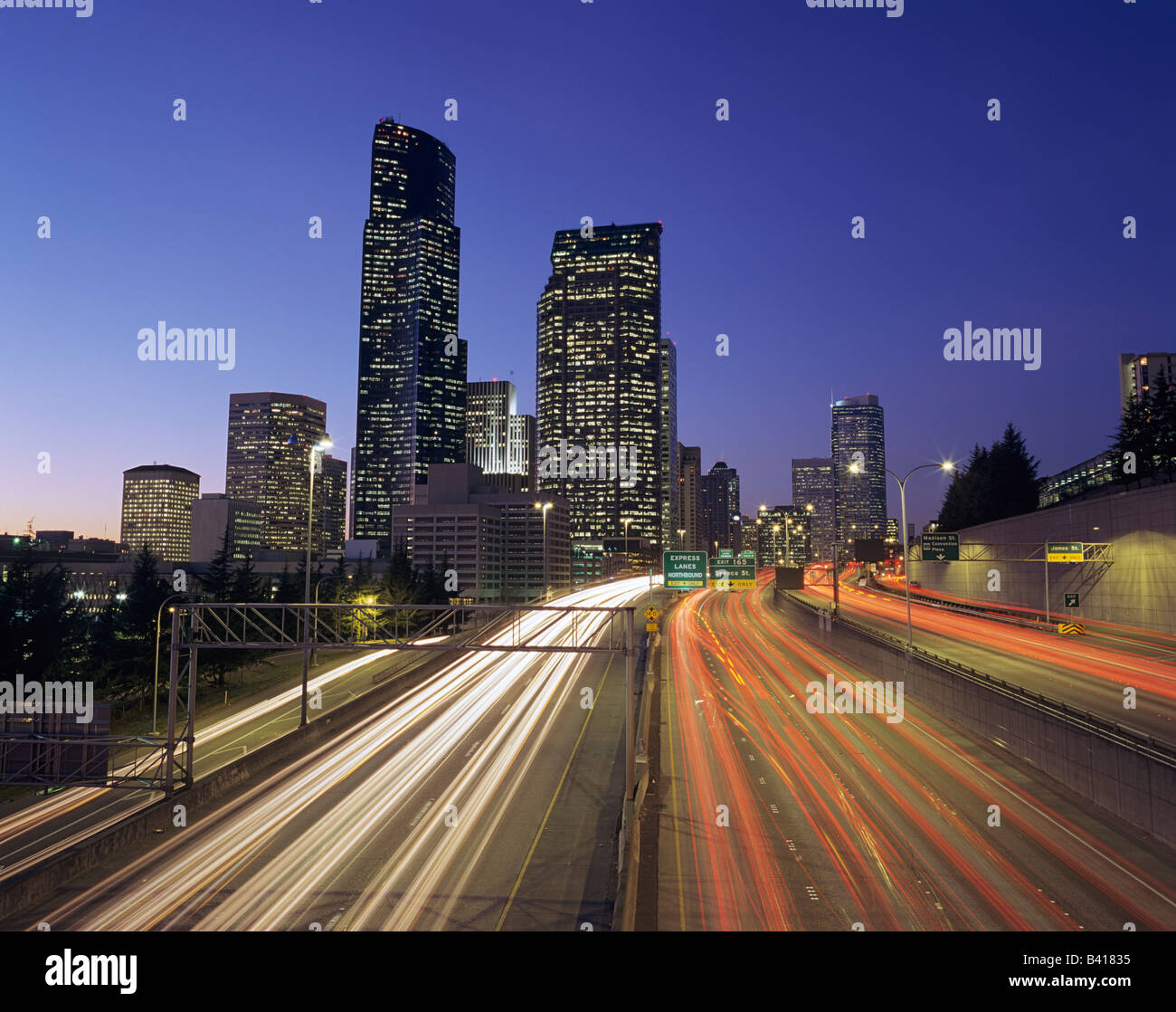 WA, Seattle, Seattle skyline with traffic on I-5 at night Stock Photo ...