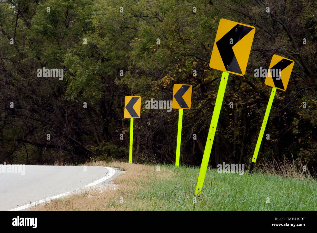 Four arrow signs at roadside Stock Photo - Alamy