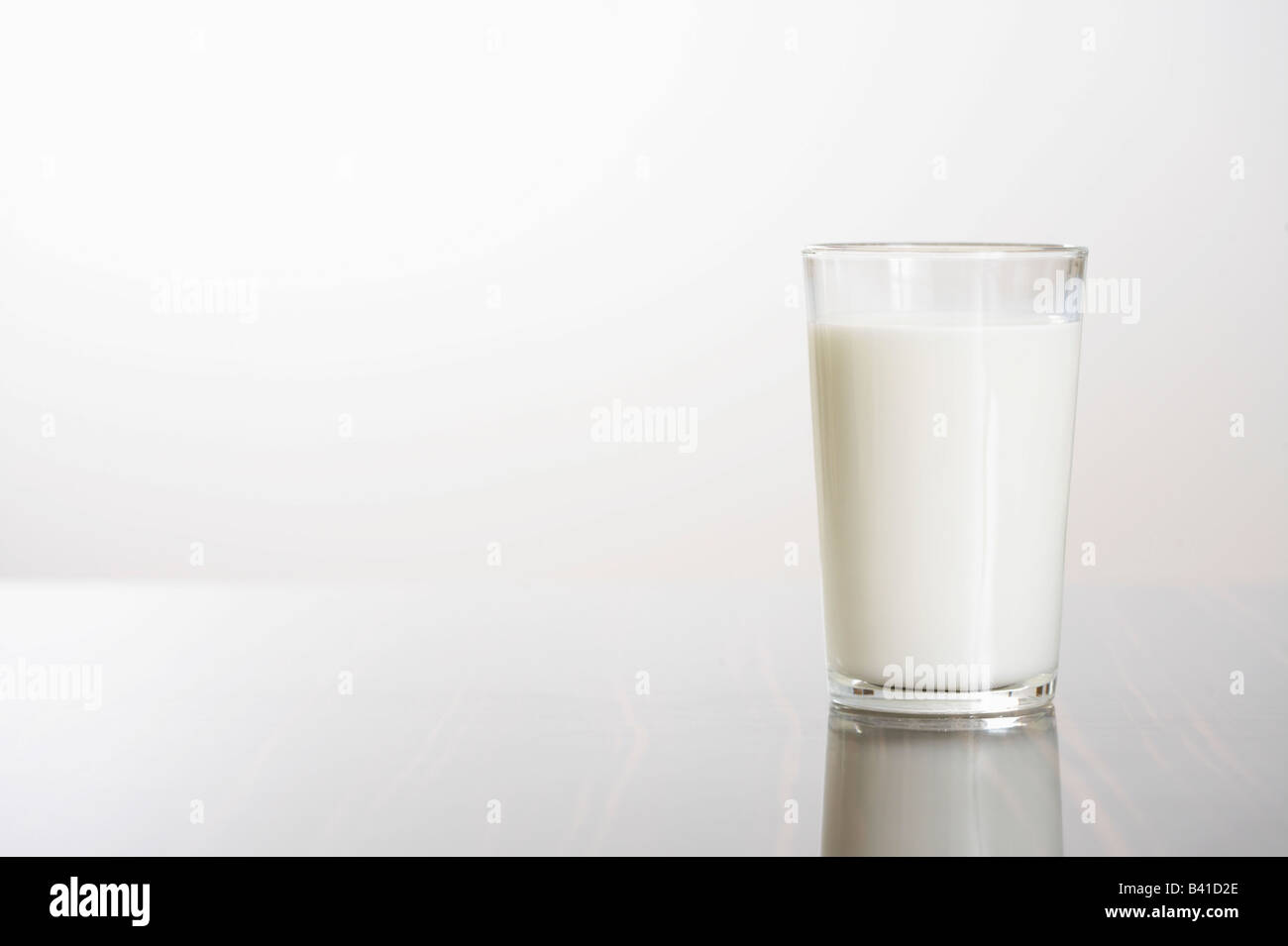 Glass filled with milk Stock Photo - Alamy