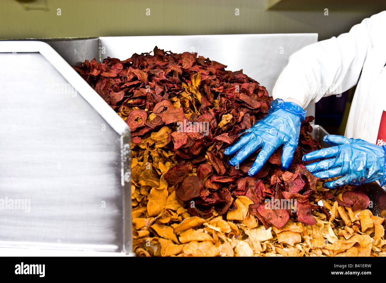 Handmade Vegetable crisps being mixed Stock Photo - Alamy
