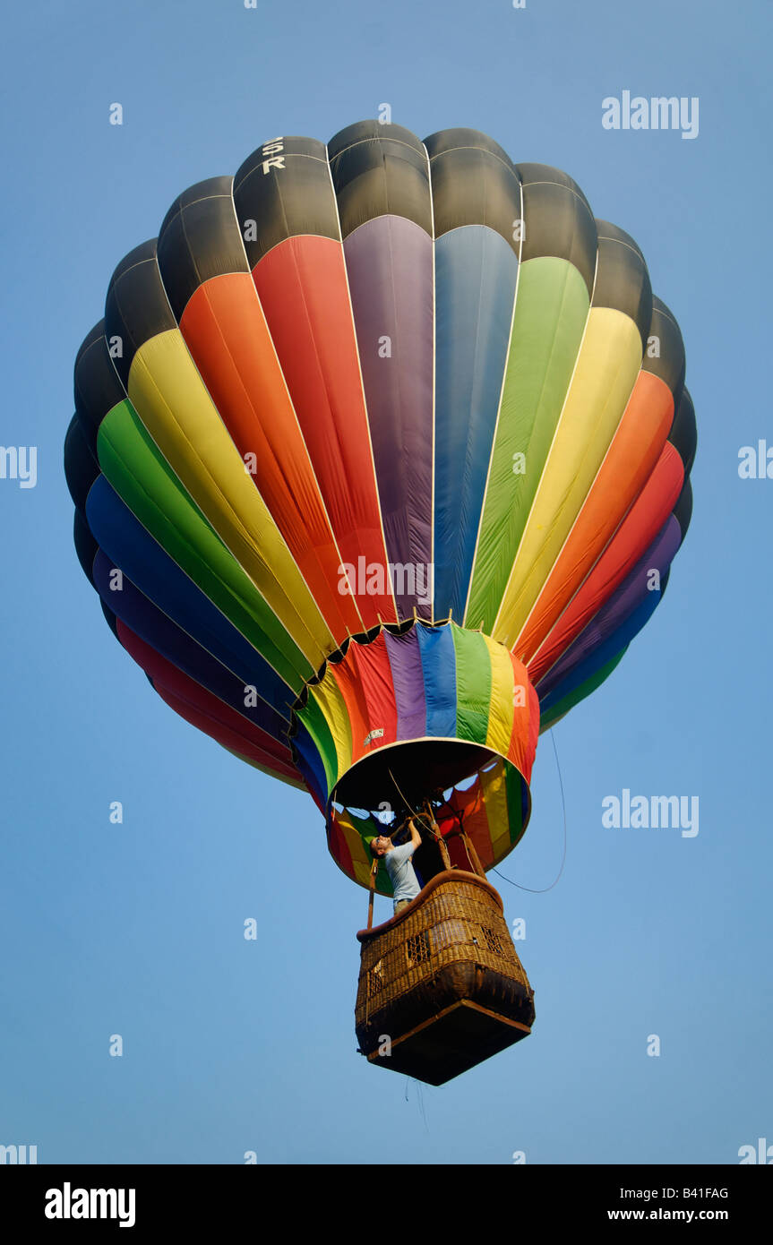 Hot Air Balloon Soaring into a Blue Sky Stock Photo - Alamy