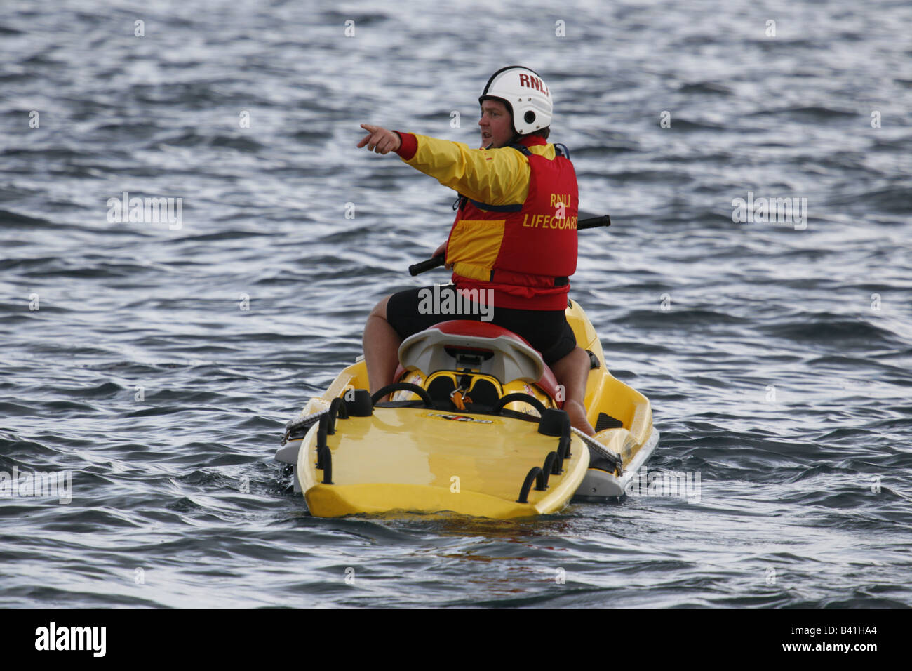 RNLI Lifeguard Directing boats on the River Fal Falmouth Cornwall ...