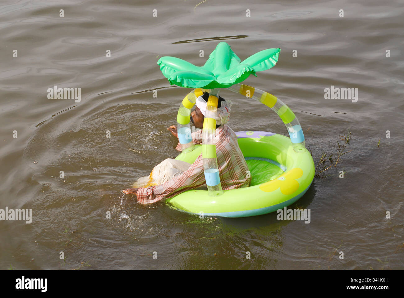 A floating man in a tube in Kerala,India Stock Photo - Alamy